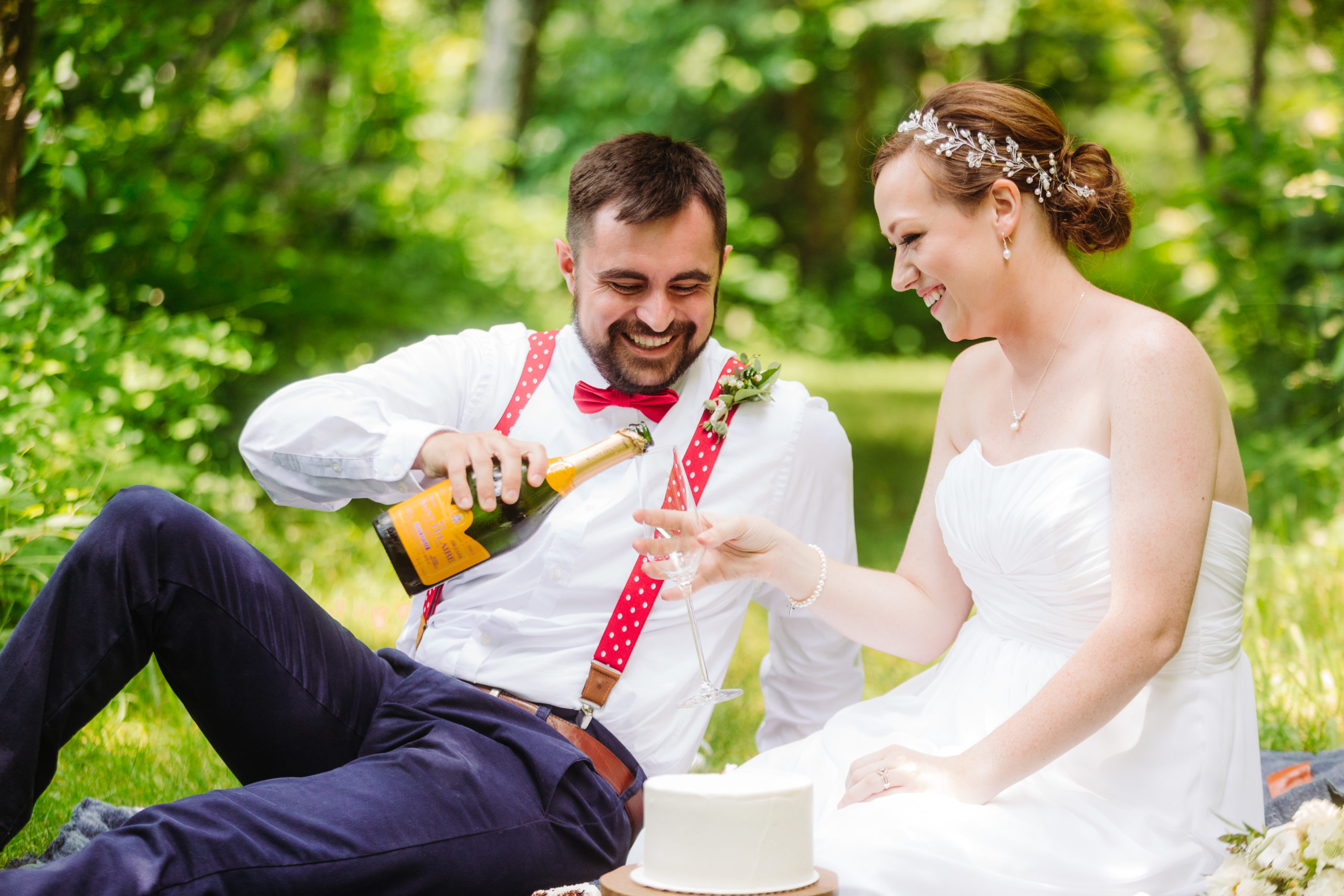 Groom serves Bride champagne ~ Elope Outdoors