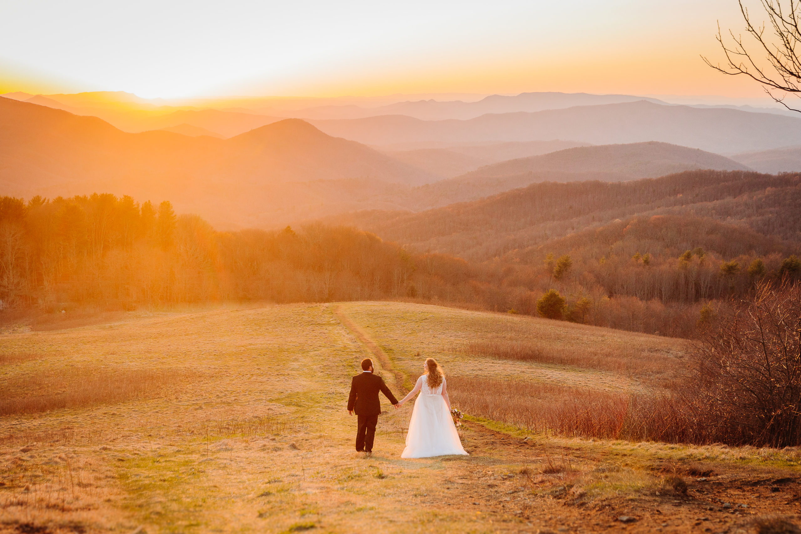 Couple walks into sunset scene ~ Elope Outdoors