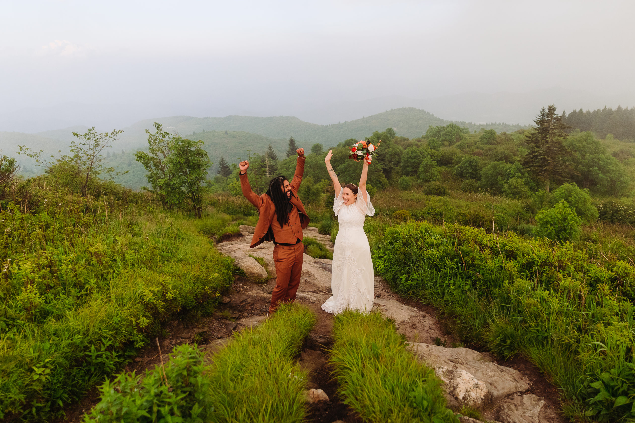 Couple celebrates eloping on a mountain Asheville elopement planner ...