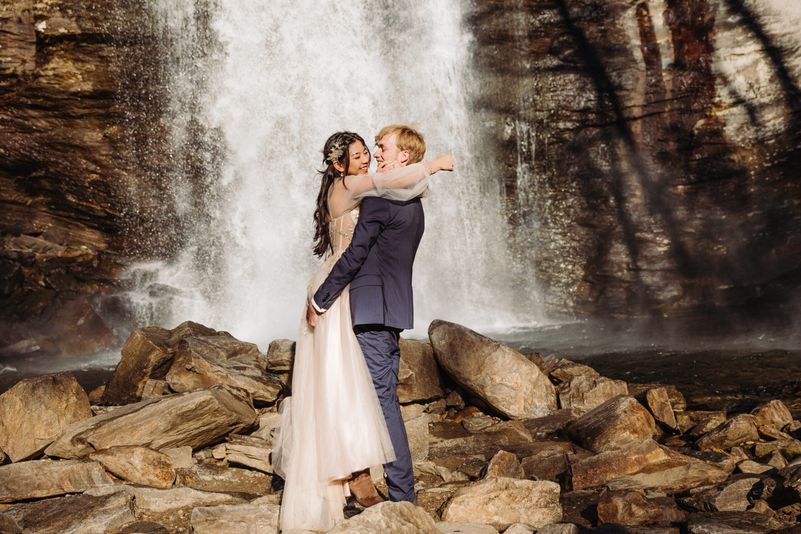 couple laughs waterfall elopement asheville ~ Elope Outdoors