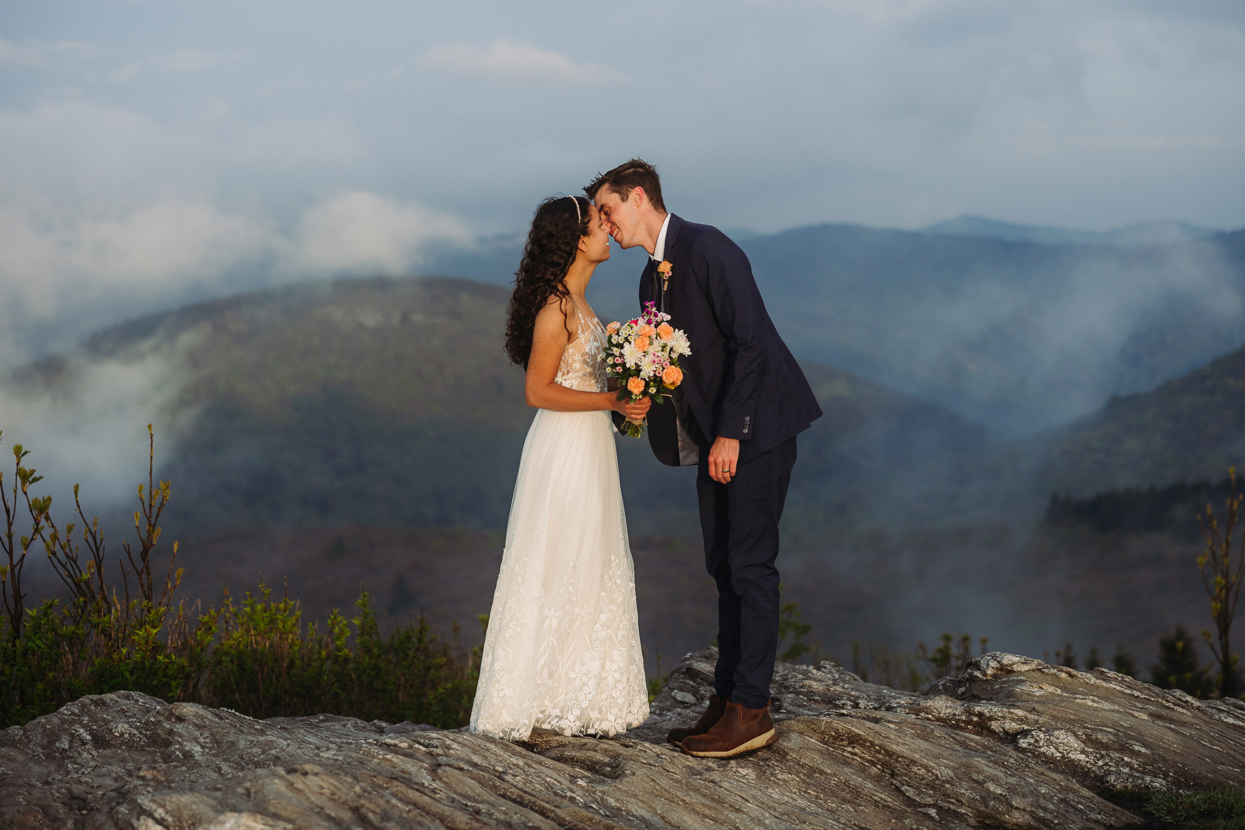 Couple kisses in the clouds Asheville Elopement Ceremony ~ Elope Outdoors